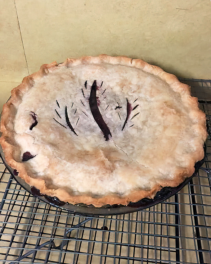 This berry pie with its rustic vents isn't trying to be perfect – it's trying to be delicious. Mission accomplished on both the eyes and taste buds.