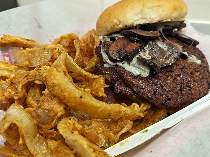 A mushroom burger that proves vegetables and beef can coexist in perfect harmony. Those caramelized onion rings aren't just toppings &ndash; they're a flavor revolution.