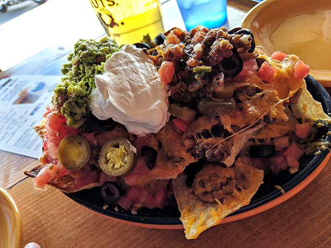 Nachos that require strategic planning and possibly a map&mdash;a mountain range of toppings where every expedition yields delicious discoveries.