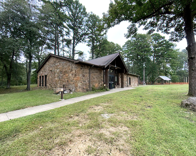 The stone nature center stands like a wise old friend, ready to explain why that plant you touched might make you itchy. 