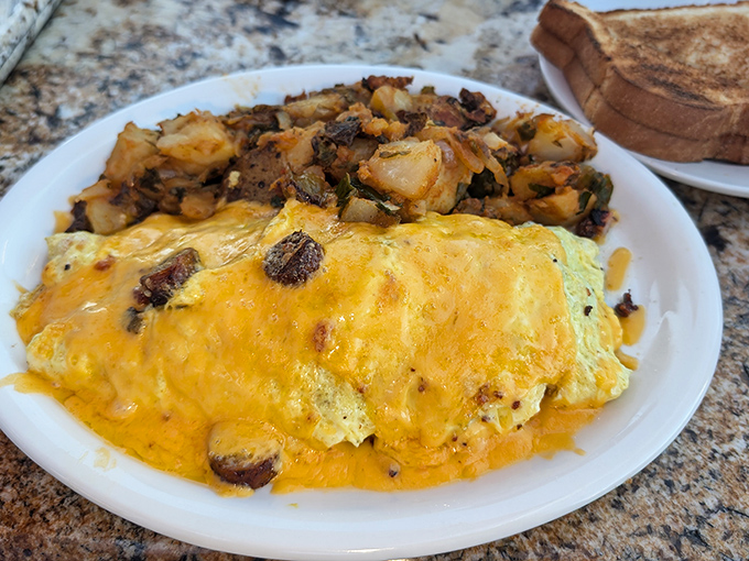 This isn't just an omelet&mdash;it's a cheese-blanketed treasure chest hiding savory secrets beneath its golden exterior.