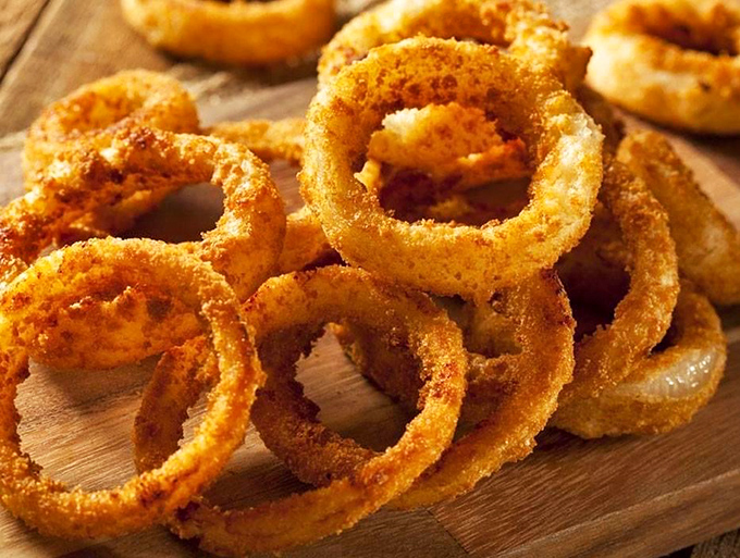 Onion rings with the perfect crunch-to-tenderness ratio&mdash;the unsung heroes of the appetizer world, ready to steal the spotlight.