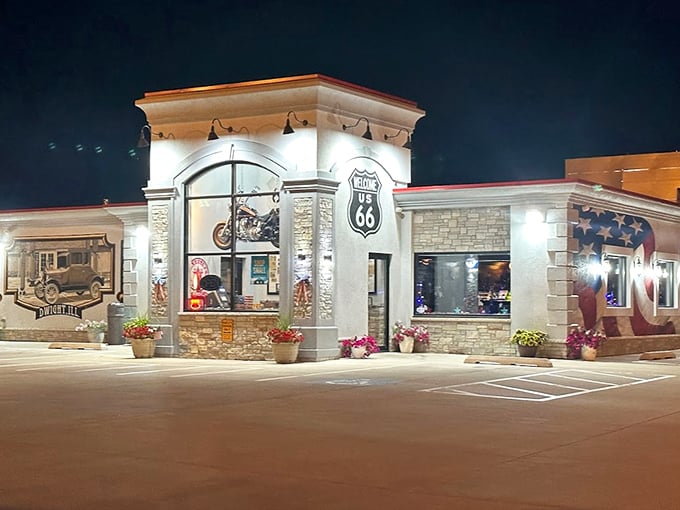 By night, the restaurant glows like a beacon for hungry travelers. The illuminated Route 66 shield is both navigation aid and quality guarantee.