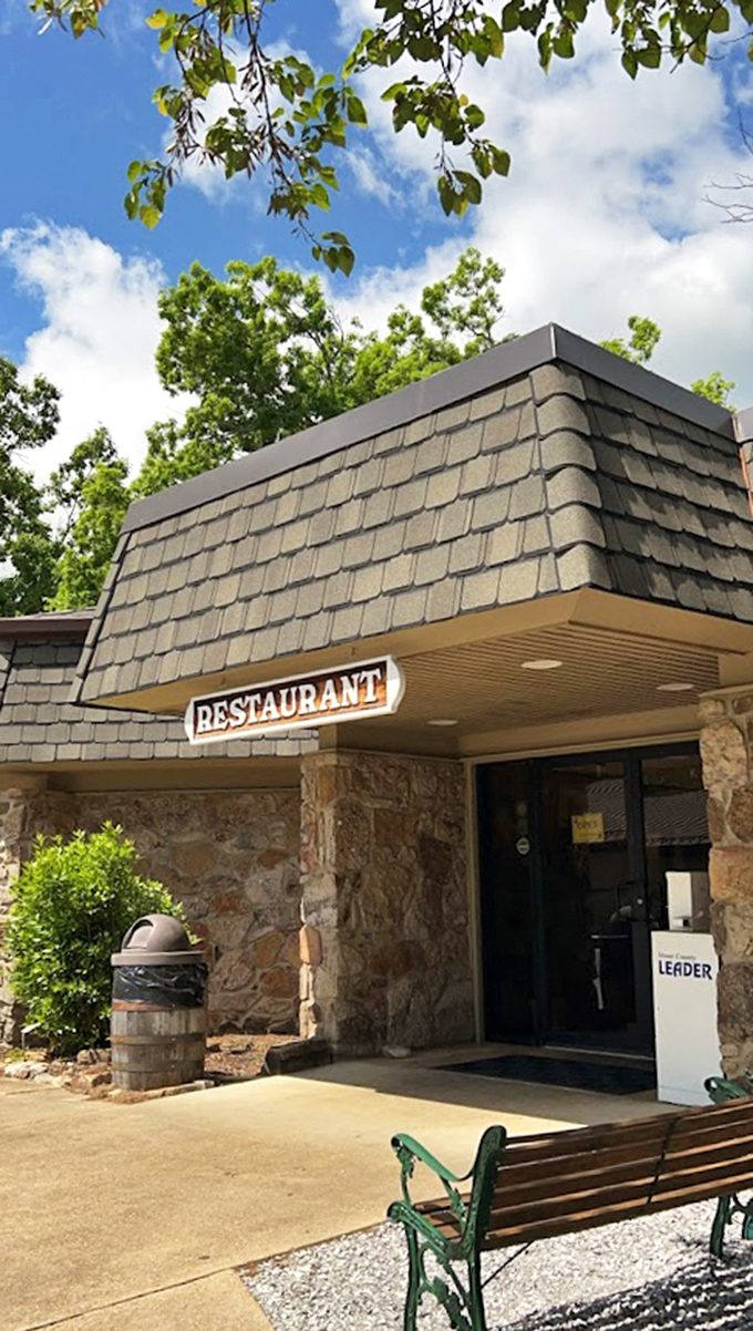 Blue skies frame the rustic exterior, inviting you into a world where time slows down and flavors are turned up. The perfect Ozark welcome.