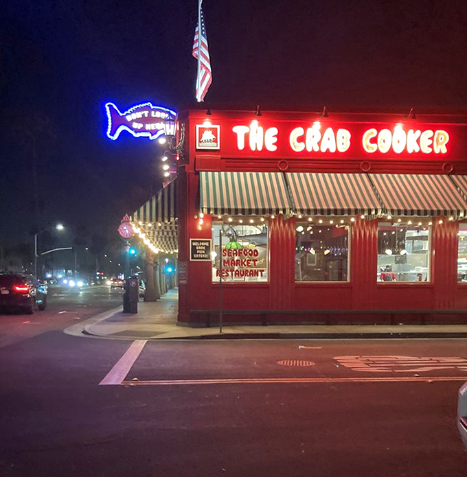 As night falls, that neon glow transforms The Crab Cooker into a beacon of seafood excellence, drawing hungry pilgrims from across Southern California.