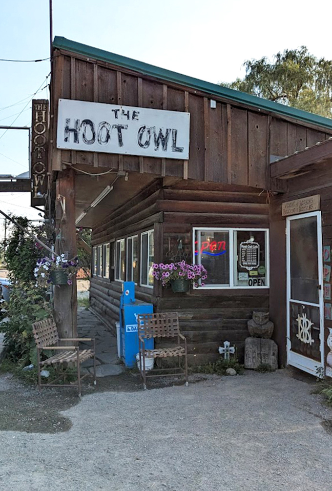 Summer flowers frame the entrance like nature's welcome mat, inviting hungry travelers into this unassuming breakfast haven.