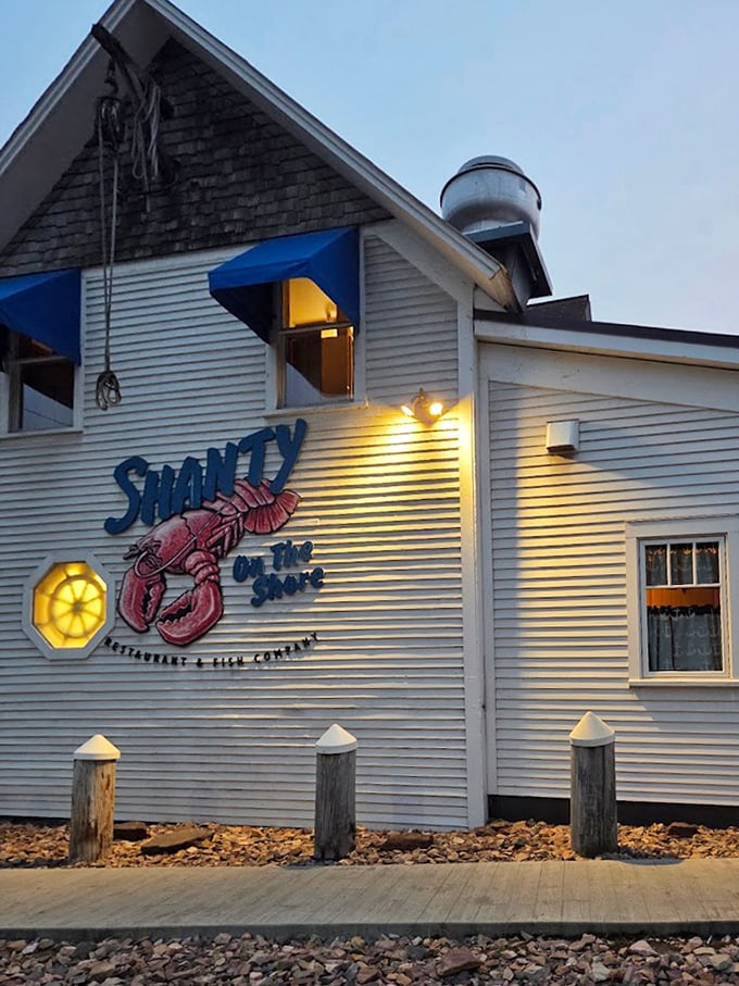 As evening falls, the Shanty's illuminated sign becomes a lighthouse for hungry travelers seeking safe harbor and excellent seafood.