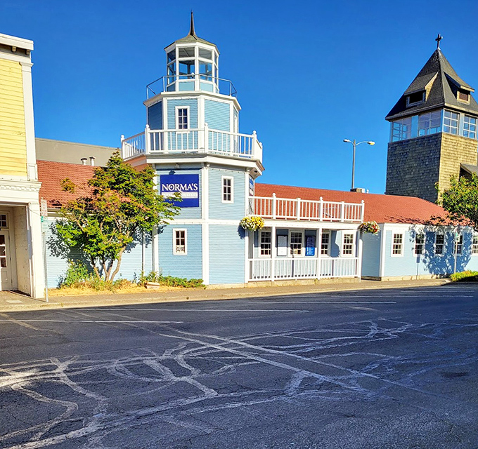 The full exterior view reveals Norma's in all its blue-hued glory—standing proud among Seaside's attractions like a delicious maritime landmark.