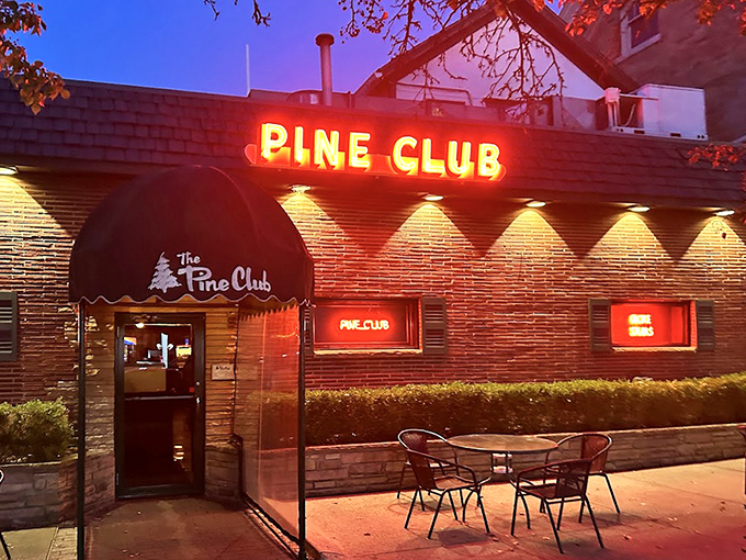 As evening falls, the neon sign becomes a beacon for steak lovers—like a lighthouse guiding hungry ships to safe harbor.