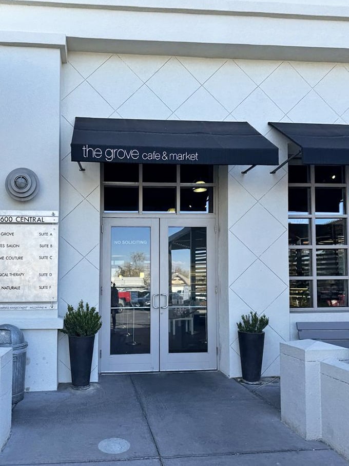 A welcoming entrance that promises culinary delights. Those potted plants stand guard like sentinels protecting breakfast treasures within.