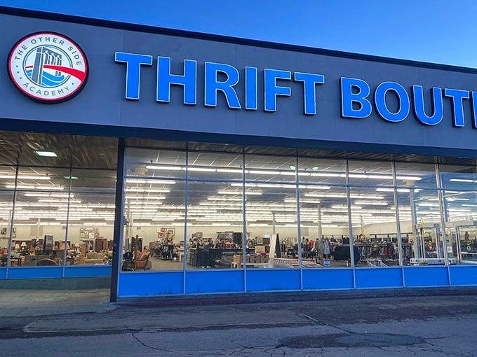 The exterior at dusk&mdash;when the blue signage glows with promise, like a beacon guiding bargain hunters safely to shore after a day of retail disappointments.