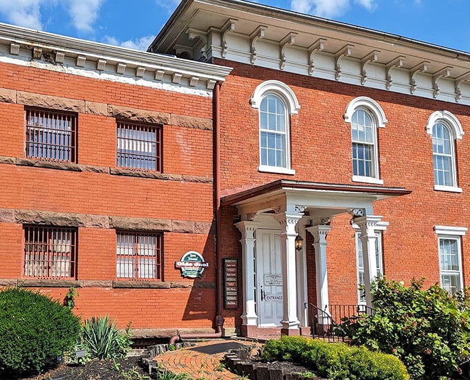 The historic brick exterior with barred windows tells you immediately: this meal comes with a side of fascinating history.