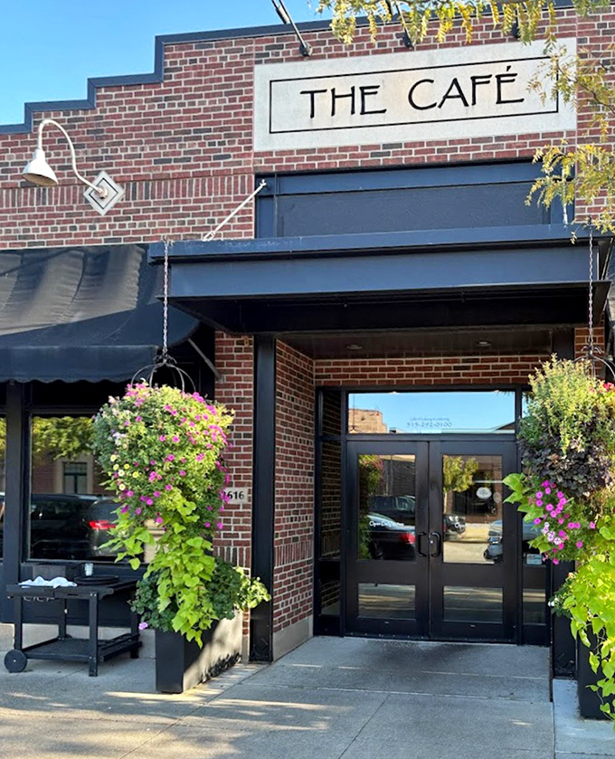 Hanging flower baskets frame the entrance like nature's welcome committee, inviting you into a world where every meal feels special.