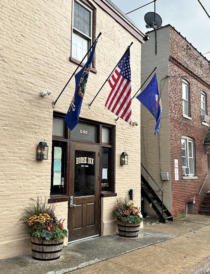 Barrel planters and that weathered brick facade &ndash; Lancaster charm without the tourist-trap theatrics.