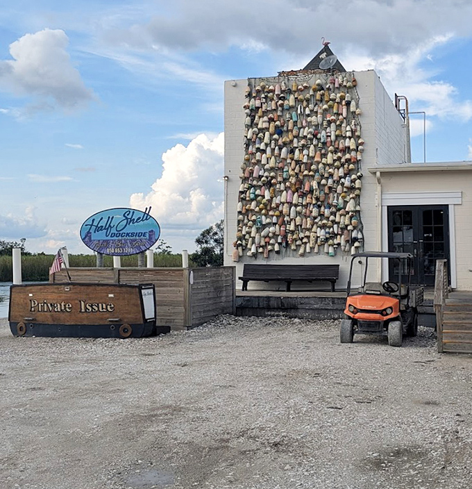 The iconic buoy wall stands as a colorful landmark—Half Shell Dockside's way of saying "Yes, this is the place your taste buds have been searching for."