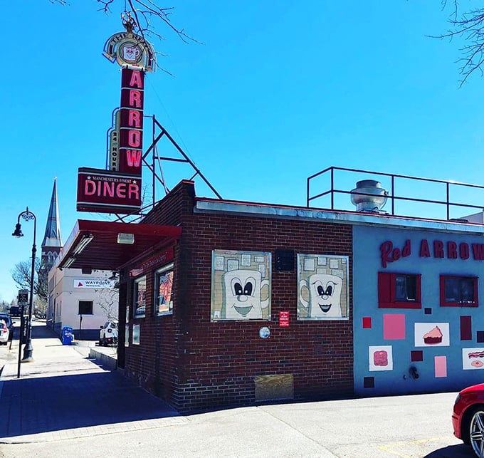 Morning light bathes the corner diner, its cheerful facade and cartoon toast windows promising that inside, everything is going to be deliciously alright.