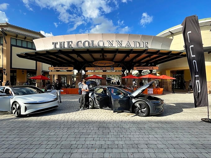Cars parked beneath The Colonnade's signature archway, their owners inside probably exceeding every budget they carefully set this morning.