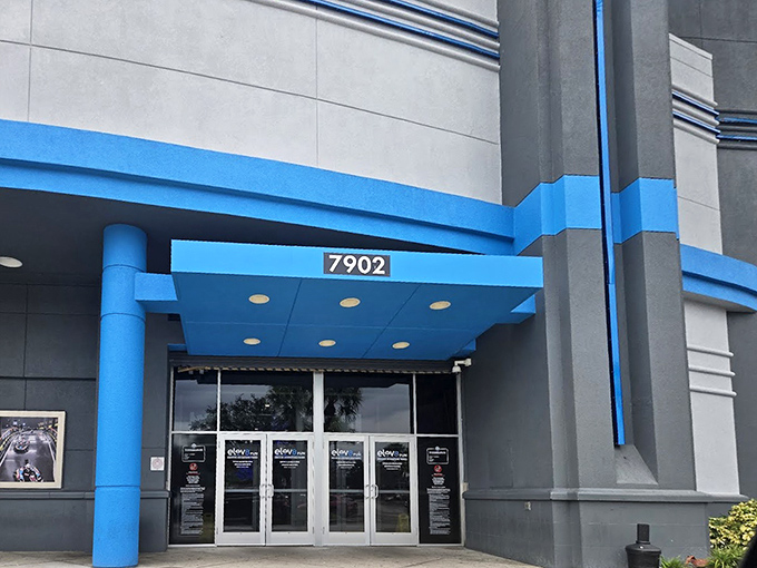 The unassuming exterior of Elev8 Fun Tampa hides the neon wonderland within, like a corporate building that secretly moonlights as a disco.