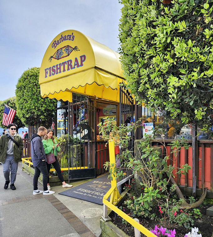 The exterior view shows why locals line up&mdash;a cheerful yellow-and-red facade that stands out among Half Moon Bay's coastal charm.