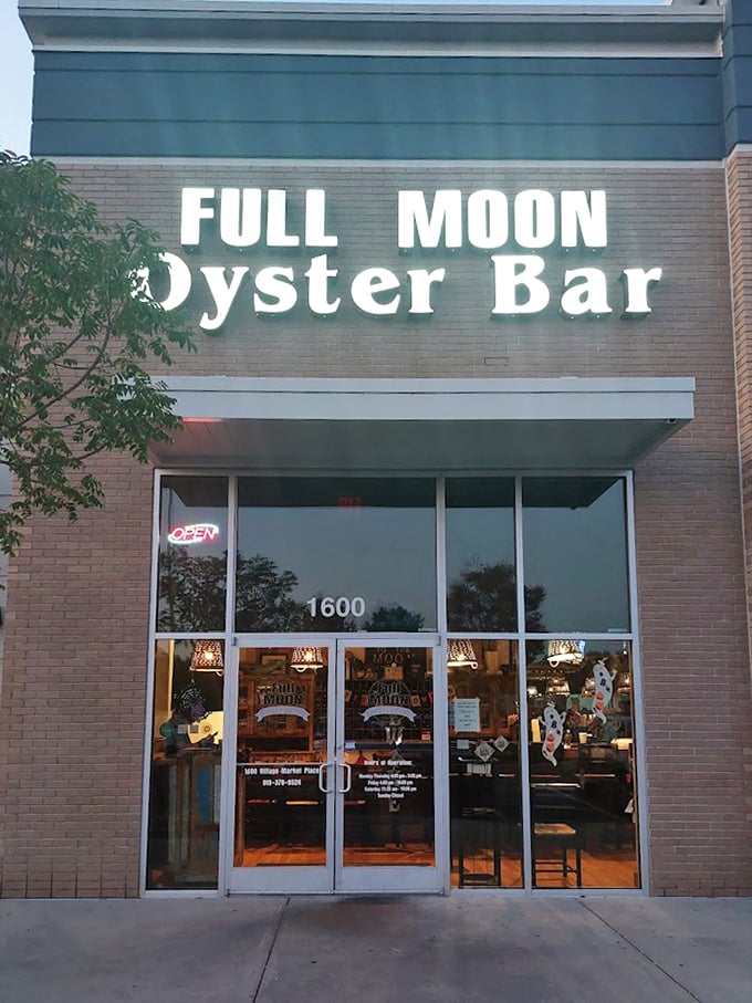 As evening approaches, the Full Moon sign glows like a beacon, guiding hungry seafood pilgrims to their destination.