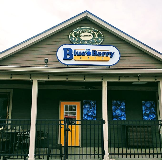The cheerful yellow door and blueberry-adorned windows promise delicious things to those wise enough to enter.