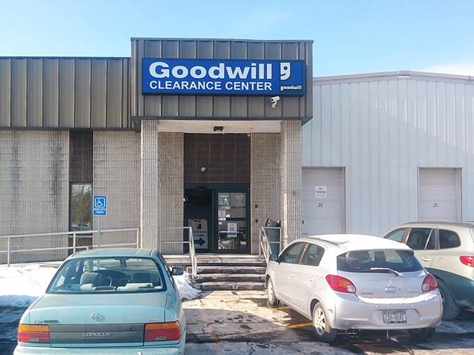 The unassuming exterior hides the wonderland within, like a speakeasy for the bargain-obsessed. Cars outside hint at the treasures being discovered.