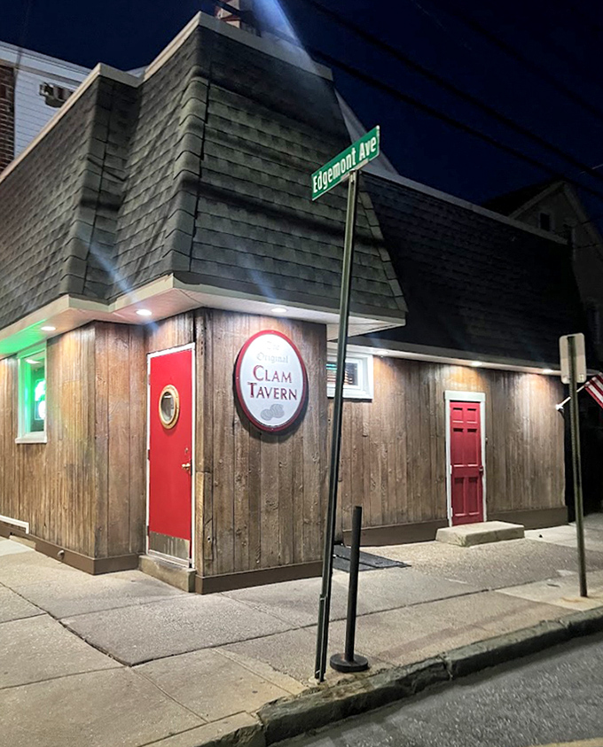 At night, the tavern's wooden exterior glows with promise. That street sign might as well read "Turn Here For Deliciousness Avenue."