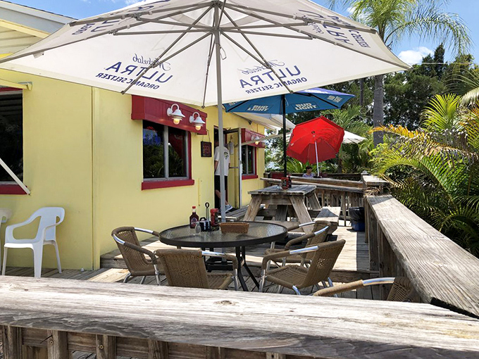 The outdoor deck offers al fresco dining under umbrellas, where Florida's sunshine is just another ingredient in a perfect meal.