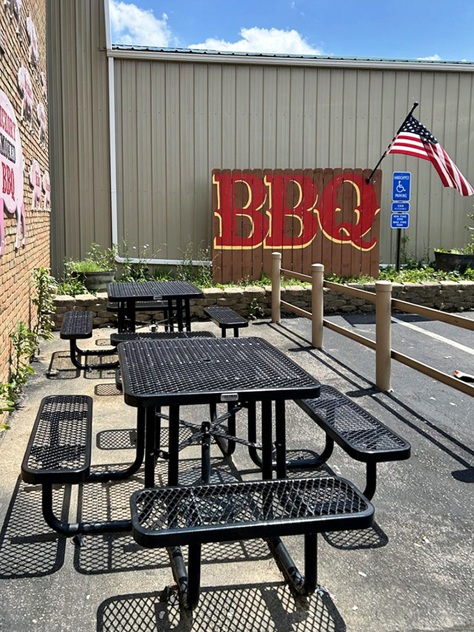 Outdoor seating where the only thing better than the food is the satisfaction of wearing your BBQ sauce badges with pride.