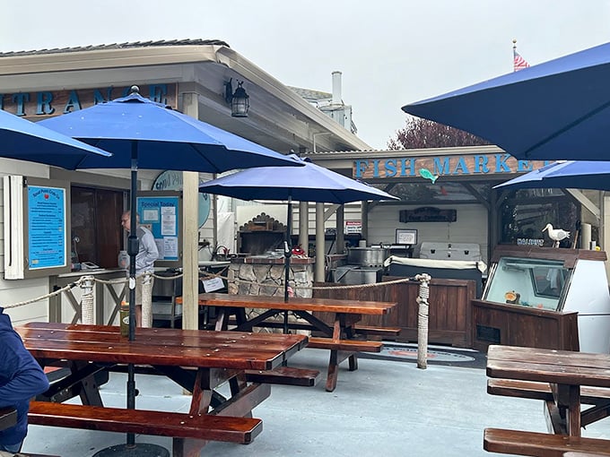 Al fresco seafood paradise. These picnic tables under blue umbrellas offer the perfect setting for communing with both nature and exceptional maritime cuisine.