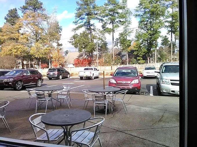 Fall colors frame the outdoor dining experience, where metal tables await conversations that will inevitably circle back to those chicken tenders.