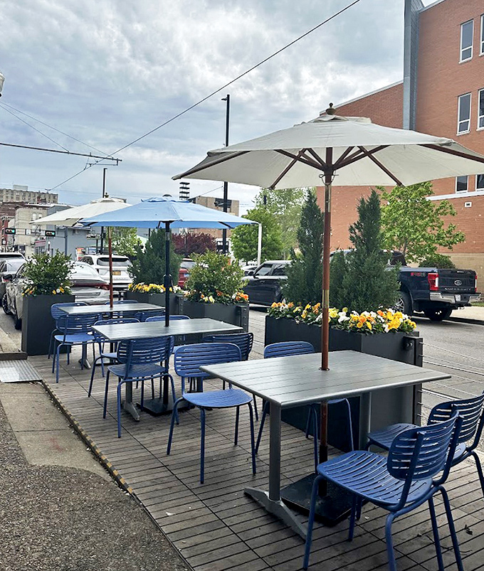 The outdoor dining area offers a breath of fresh air with blue chairs and umbrellas&mdash;perfect for people-watching while demolishing your burger.