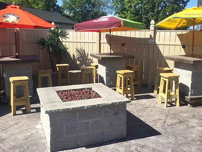 Fire pit, wooden stools, and colorful umbrellas&mdash;the outdoor patio isn't just an addition, it's where summer memories are crafted one wing at a time.