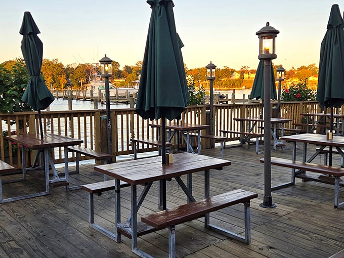 The deck at golden hour&mdash;empty tables waiting for tomorrow's crowd, lanterns ready to illuminate evening feasts, and a sunset view that no five-star restaurant could improve upon.