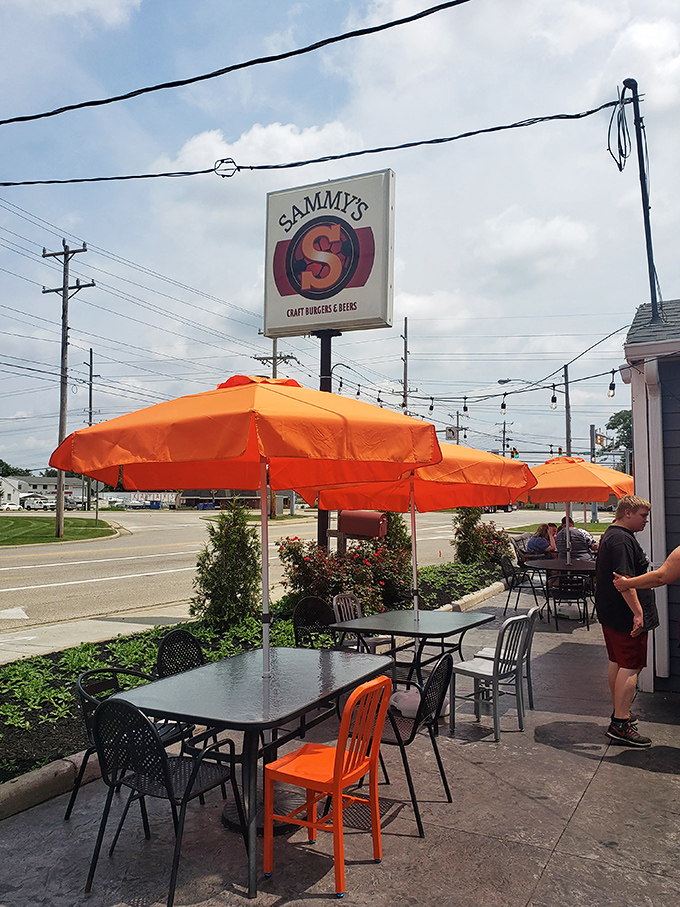 Orange umbrellas create an oasis of outdoor dining possibility. When Ohio weather cooperates, this patio becomes prime real estate for burger aficionados.