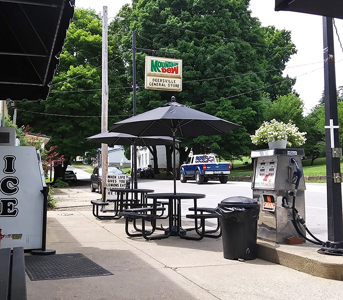 Outdoor seating where ice cream meets fresh air. The Mountain Dew sign stands as a beacon of refreshment for weary travelers.