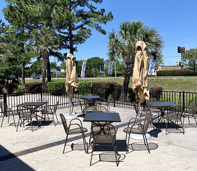The outdoor patio offers al fresco dining surrounded by palm trees and pines&mdash;nature's way of saying "enjoy your breakfast with a side of vitamin D."