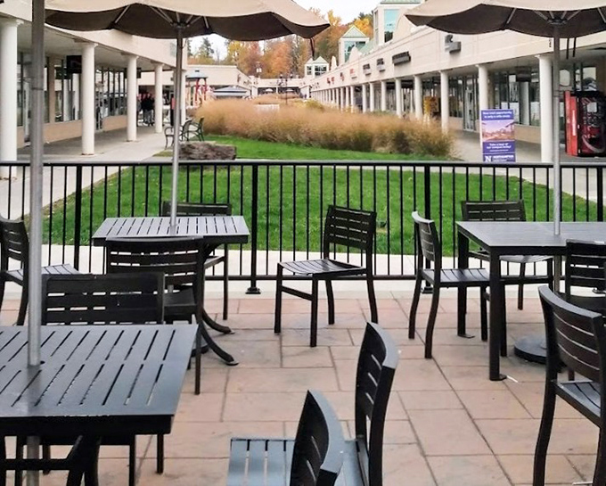 Outdoor dining areas invite shoppers to rest weary feet and compare treasures before the next retail assault. Strategic planning happens here.