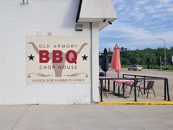 Outdoor seating with the "Top 10 BBQ in Iowa" sign proudly displayed. Fresh air makes the perfect appetizer for smoked perfection.