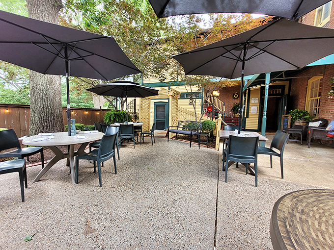 The patio at Hendel's – where summer evenings become magical under umbrellas and dappled sunlight. Missouri's version of dining al fresco done absolutely right.