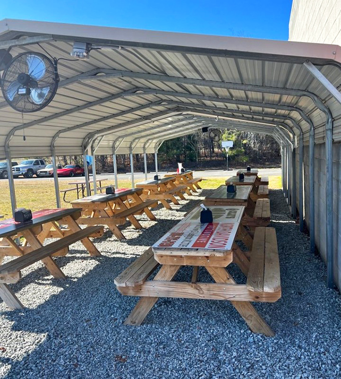 Outdoor seating under a simple shelter&mdash;where picnic tables invite you to enjoy your burger with a side of fresh air and conversation.