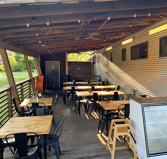 Outdoor seating under exposed beams where you can watch the world go by while demolishing a brisket grilled cheese paradise.