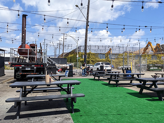 The outdoor seating area, complete with string lights and smokers, feels like the backyard barbecue of your dreams&mdash;if your dreams had better equipment.