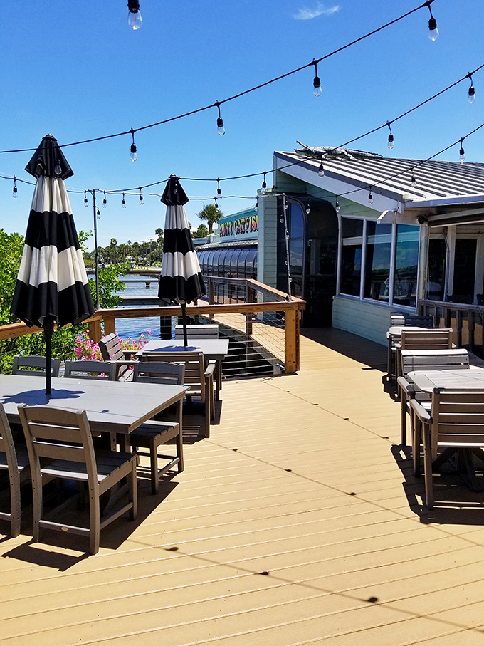 The outdoor deck beckons with string lights and river breezes&mdash;where seafood tastes even better with a side of sunshine.