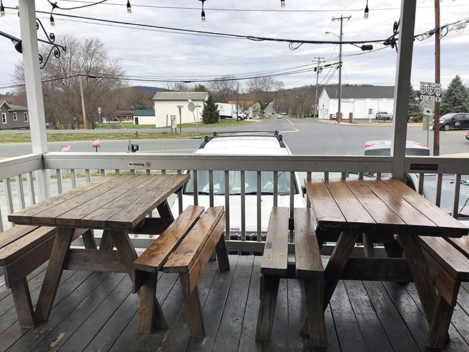 The front porch with weathered picnic tables offers a front-row seat to Gordonsville life and the perfect stage for your upcoming meat sweats.