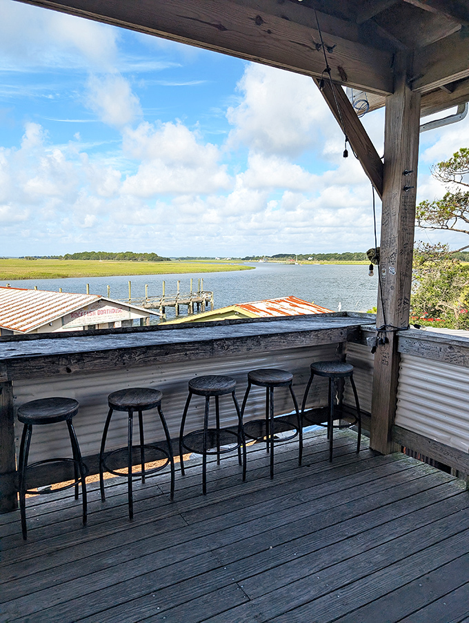 A row of stools facing the Lowcountry's greatest show: tidal marshes stretching to the horizon. Nature's version of dinner theater, no ticket required.