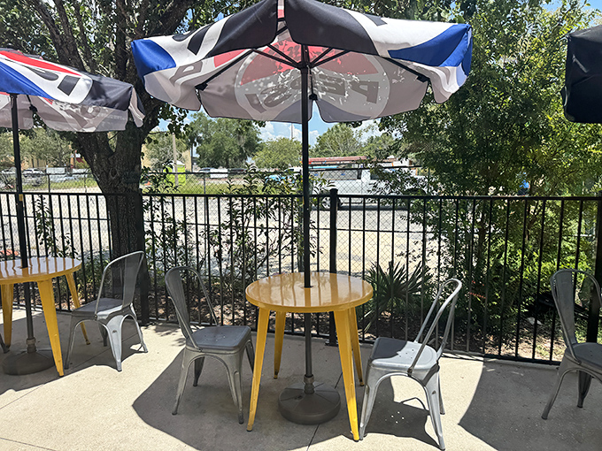 The outdoor seating area &ndash; where yellow tables and market umbrellas create the perfect stage for the post-barbecue food coma you've earned.