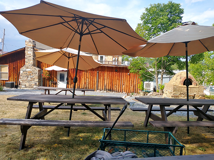 The outdoor seating area offers picnic tables under umbrellas&mdash;because pizza this good deserves fresh air and Pennsylvania sunshine.
