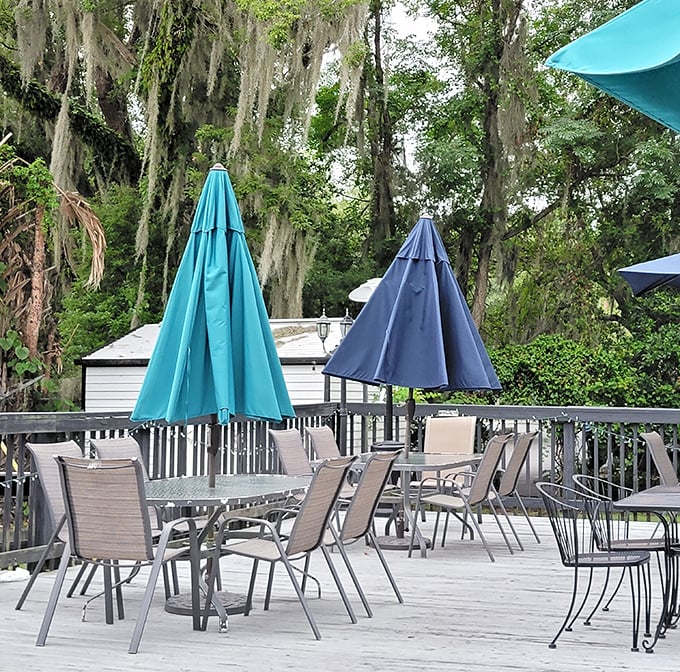 Umbrella-shaded tables on the spacious deck invite you to dine al fresco while surrounded by Florida's lush natural canopy.
