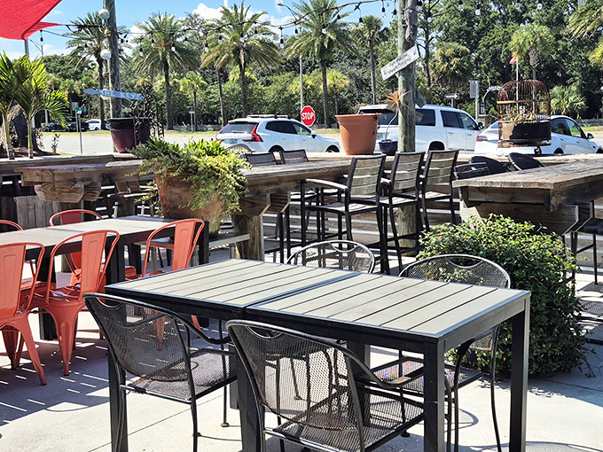 The outdoor patio, with its mix of metal and wooden furniture, invites you to enjoy your sandwich in the Florida sunshine. Beach vibes without the sand in your food.